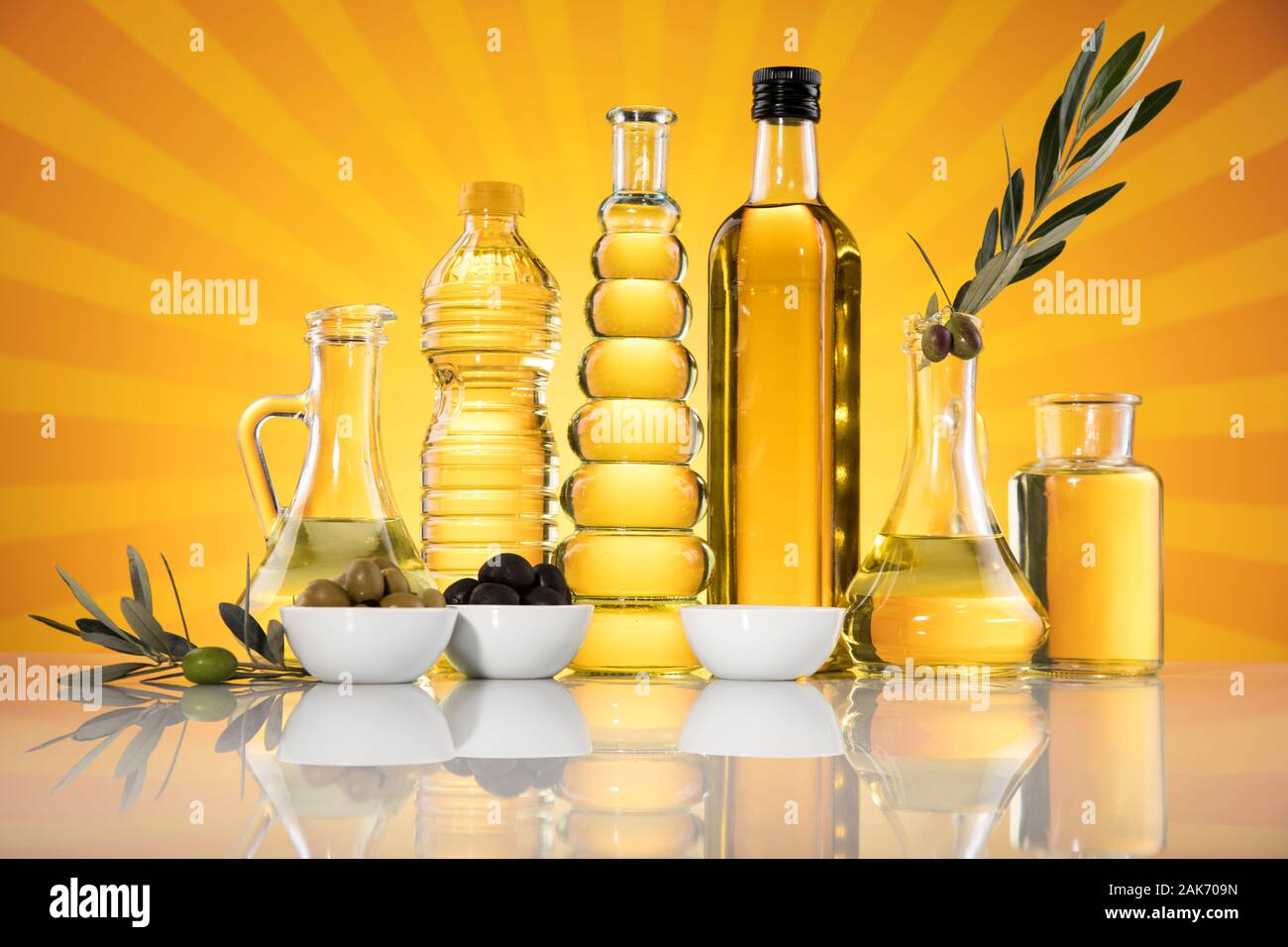 Bottles of olive oil, olive branch and Cooking oils Stock Photo - Alamy