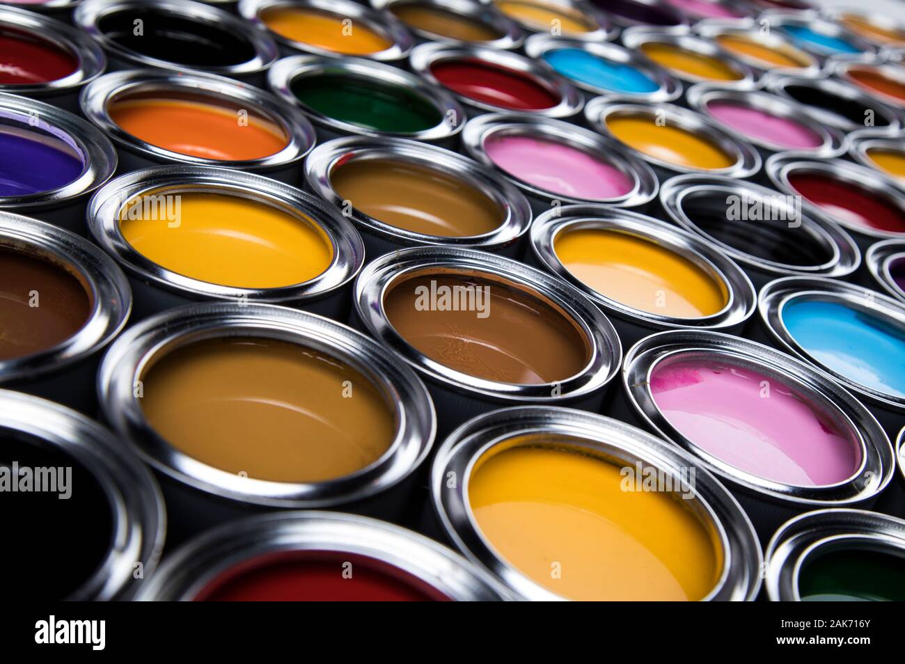 Group of tin metal cans with color paint Stock Photo - Alamy