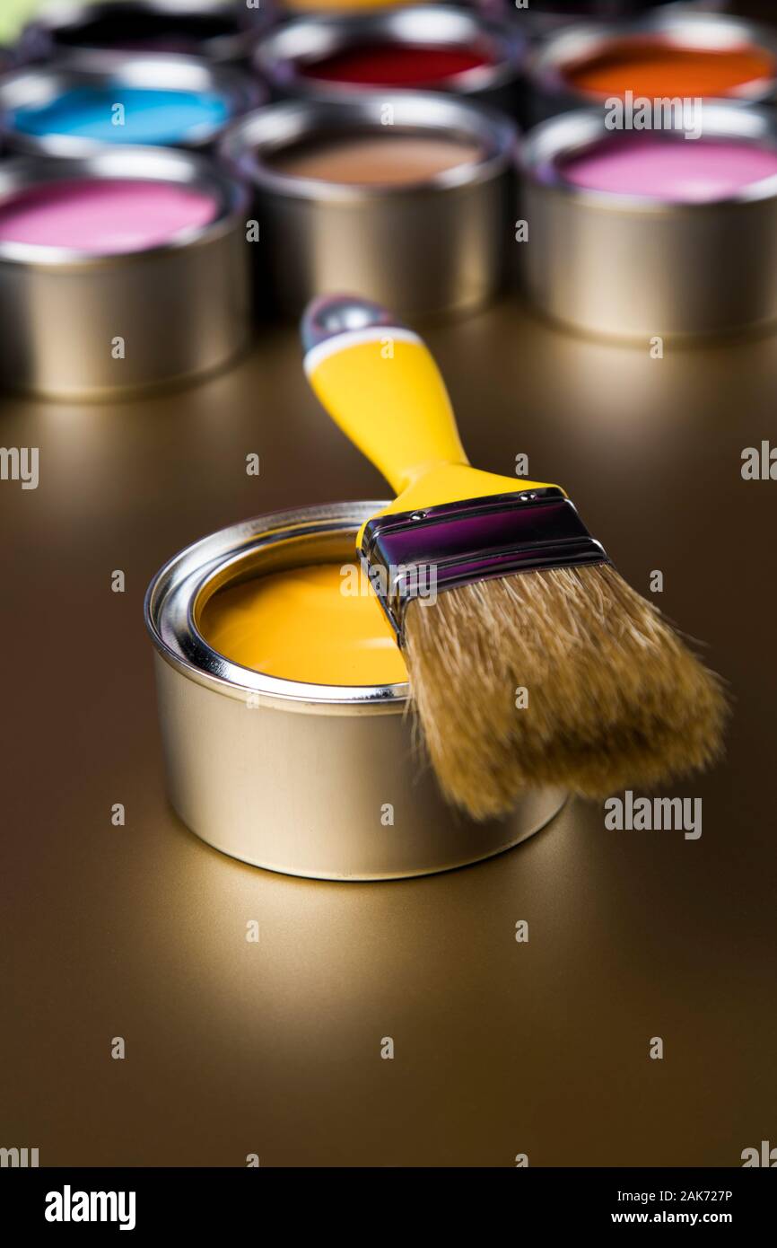 Metal tin cans with color paint and paintbrush Stock Photo - Alamy