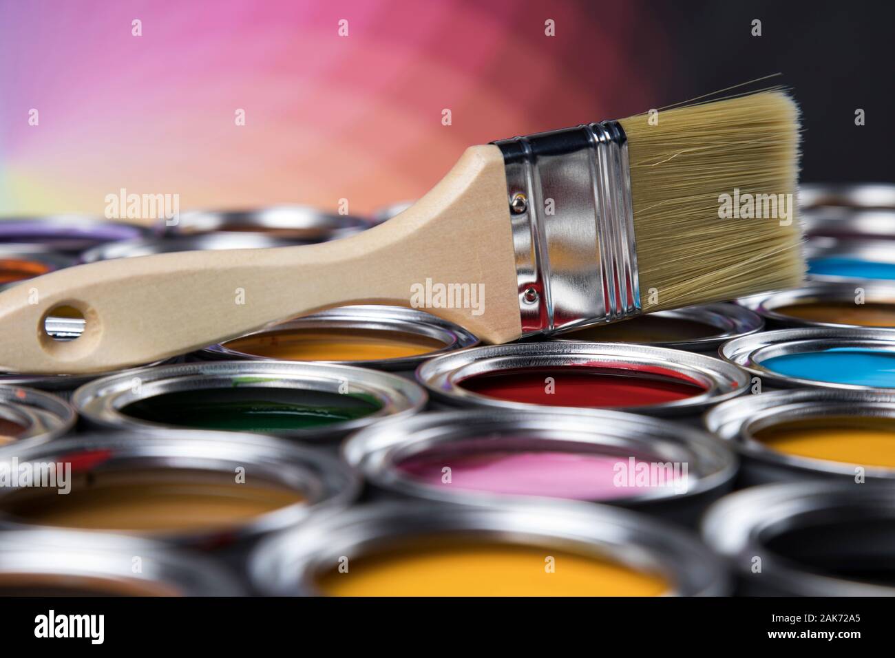 Metal tin cans with color paint and paintbrush Stock Photo - Alamy