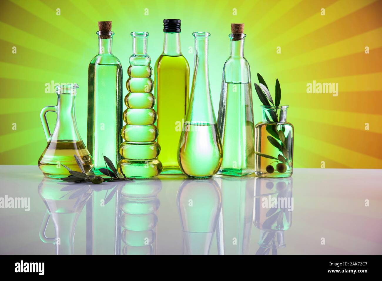 Bottles of olive oil, olive branch and Cooking oils Stock Photo - Alamy