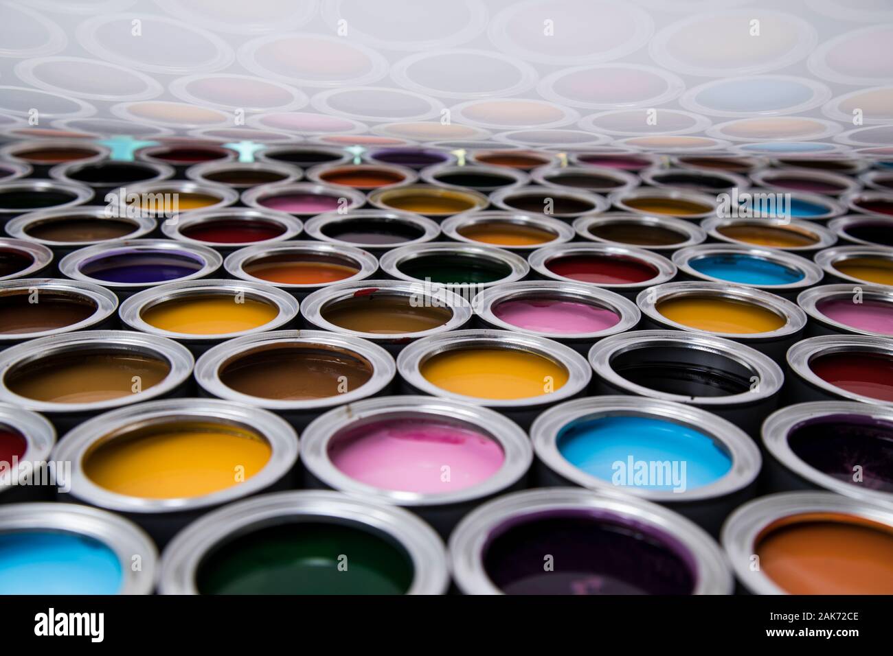Group of tin metal cans with color paint Stock Photo - Alamy
