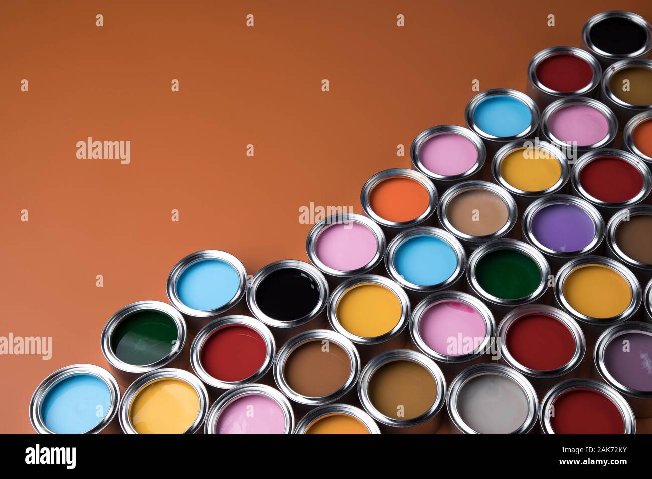 Group of tin metal cans with color paint Stock Photo - Alamy