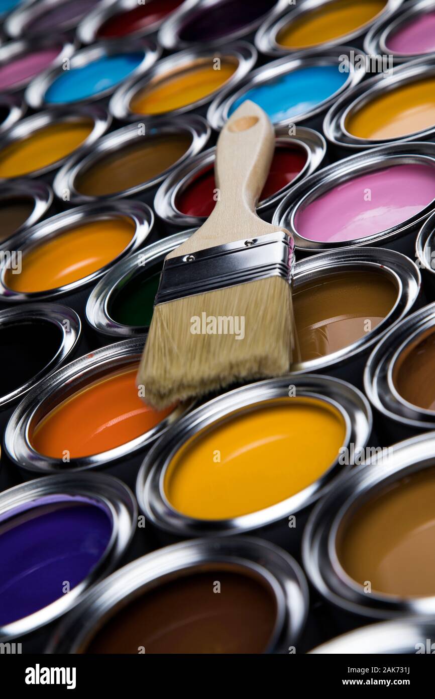 Metal tin cans with color paint and paintbrush Stock Photo - Alamy
