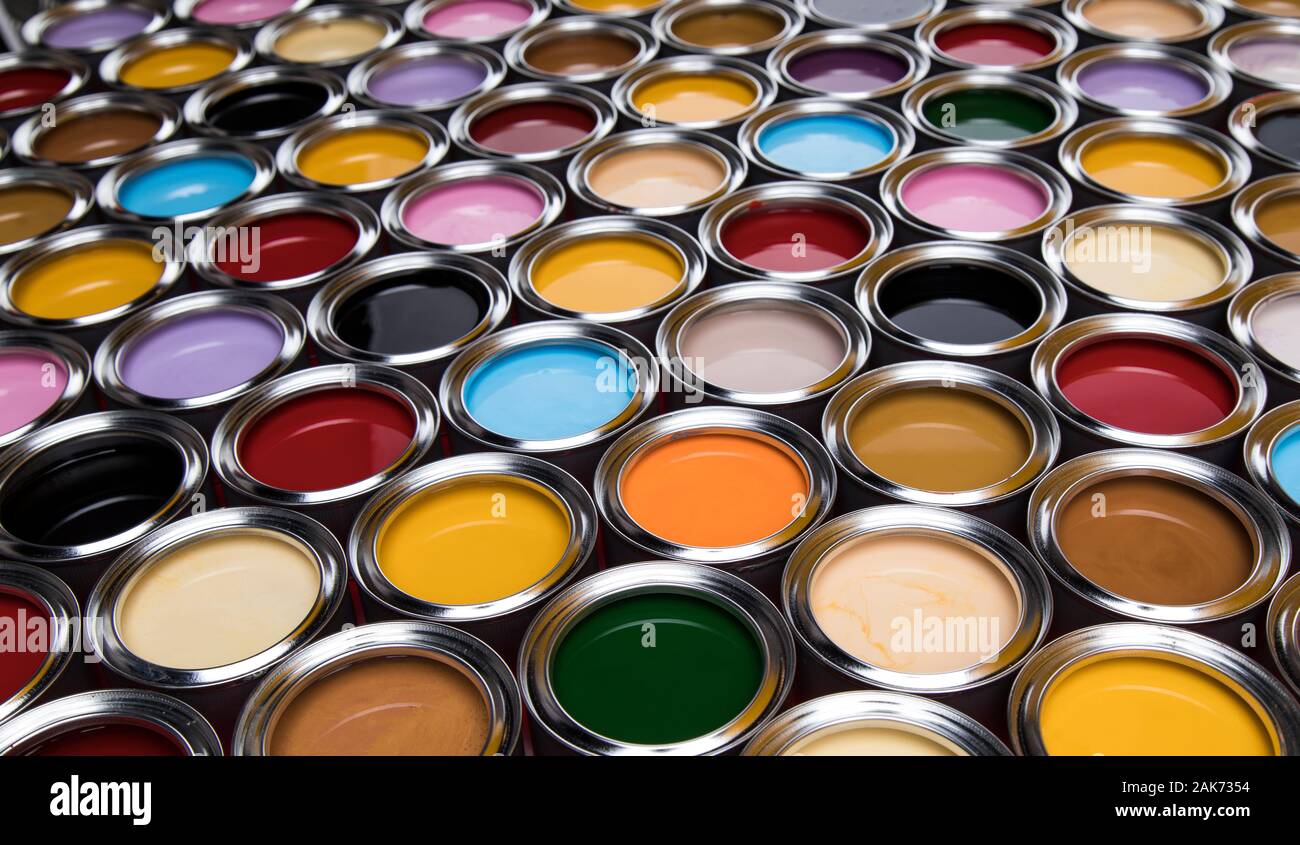 Group of tin metal cans with color paint Stock Photo - Alamy