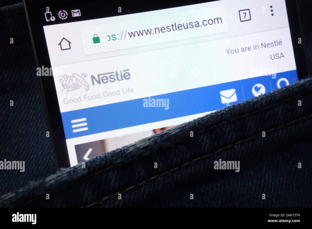 Nestle website displayed on smartphone hidden in jeans pocket Stock ...