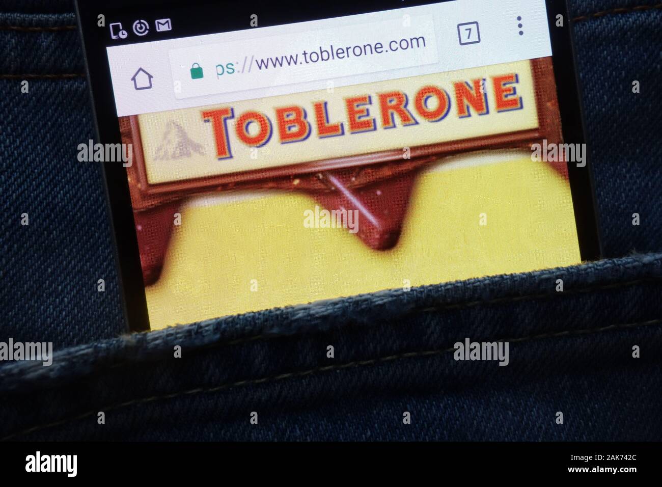 Toblerone website displayed on smartphone hidden in jeans pocket Stock ...