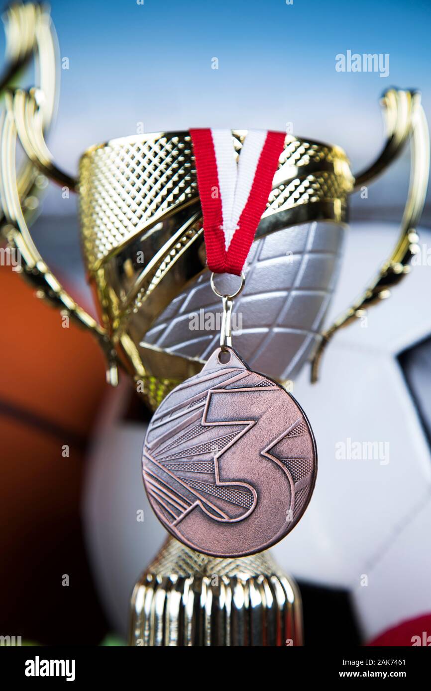 Trophy cup and sport ball background Stock Photo - Alamy