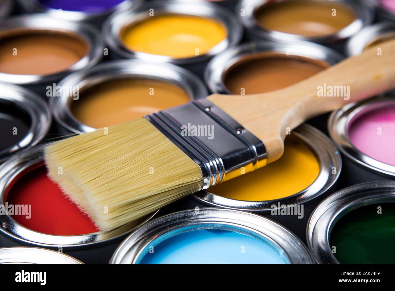Metal tin cans with color paint and paintbrush Stock Photo - Alamy