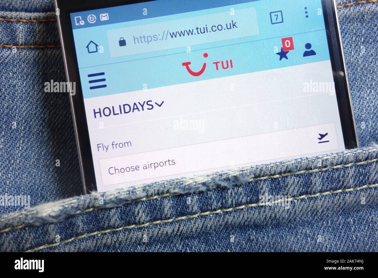 Tui website displayed on smartphone hidden in jeans pocket Stock Photo ...