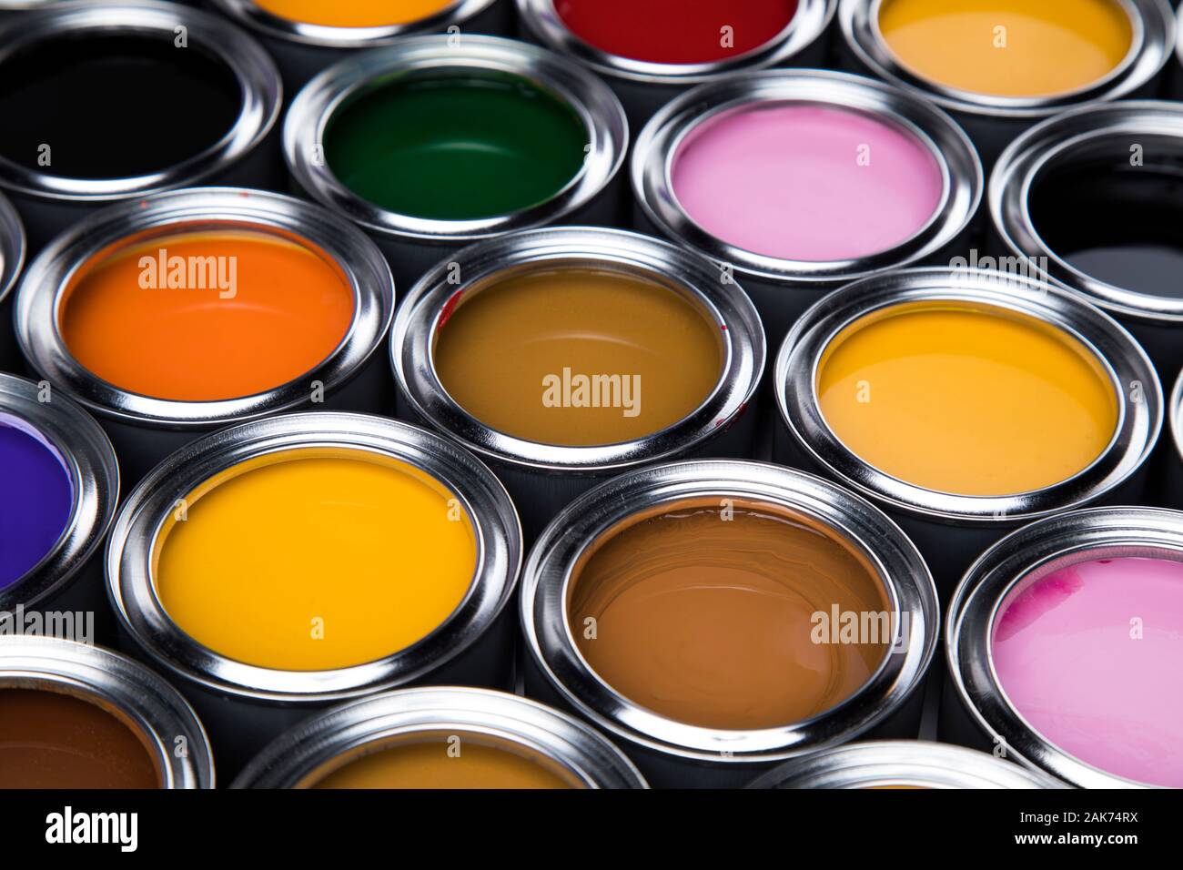 Group of tin metal cans with color paint Stock Photo - Alamy