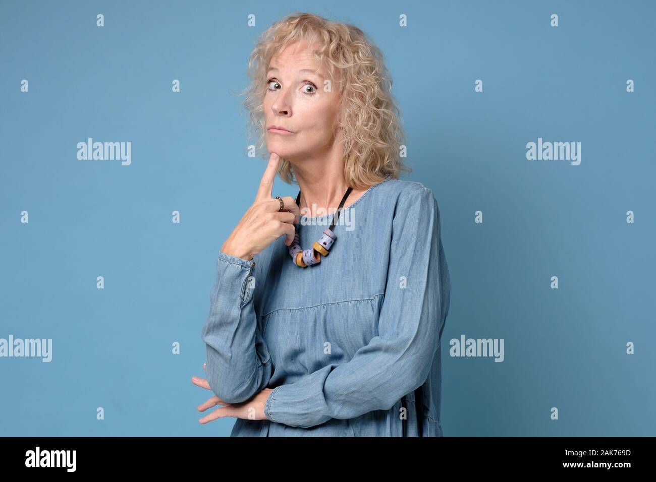 Disappointed elder woman looking camera hi-res stock photography and ...