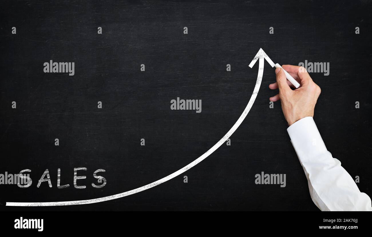 chalk drawing sales growth graph withchalk and handdrawing on the ...