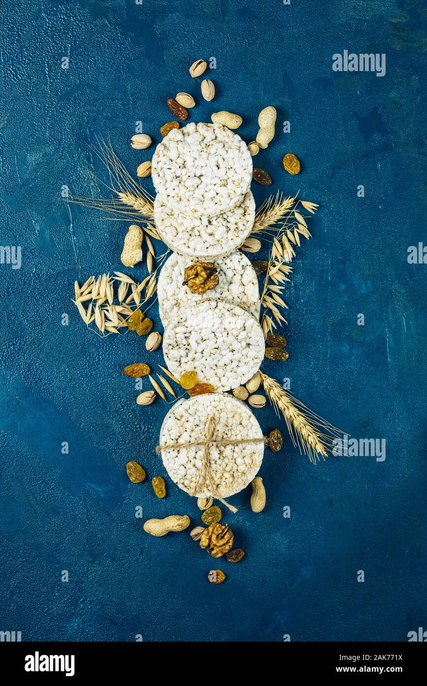 American puffed rice cakes. Healthy snacks with ears of wheat on ...