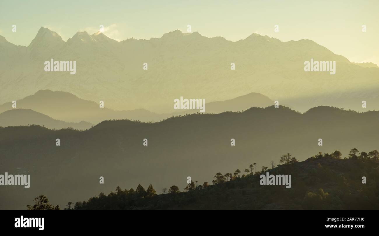 A beautiful, scenic landscape of a shaft of sunlight slanting across ...