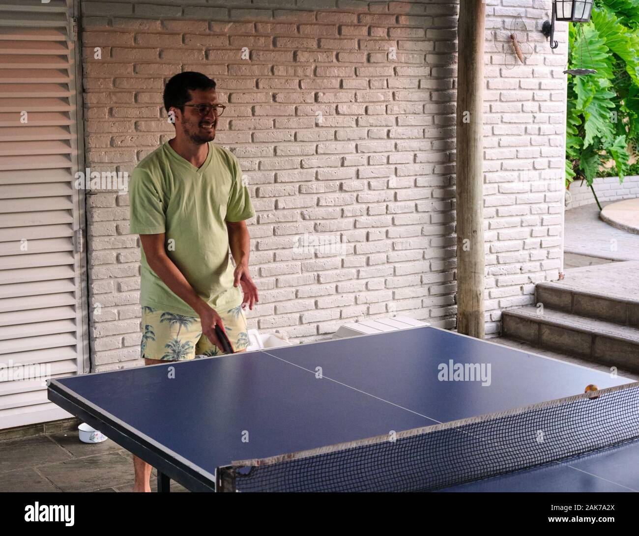 a young men playing table tennis Stock Photo - Alamy