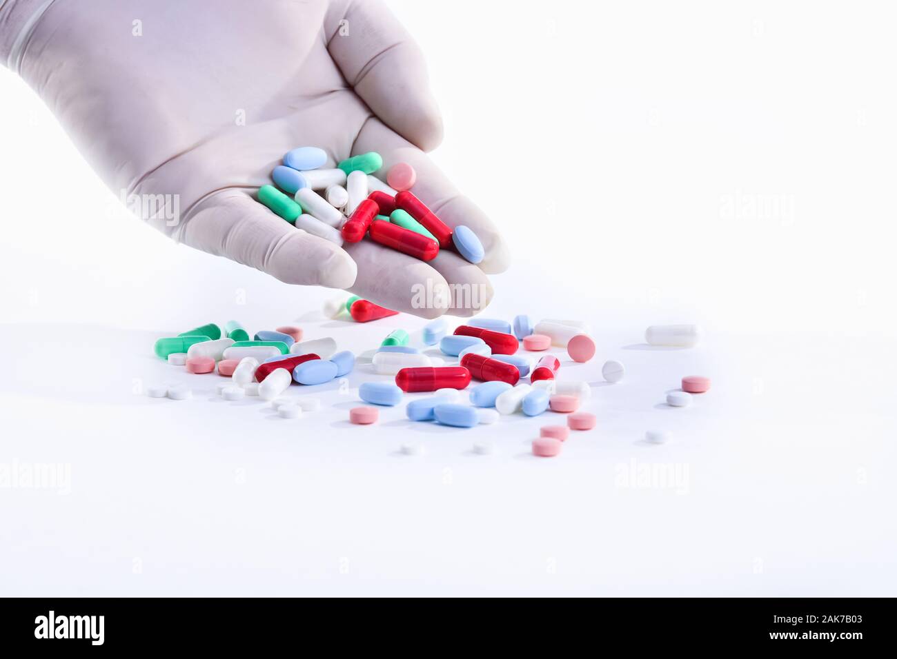 Medication dosage hand glove pill hi-res stock photography and images ...
