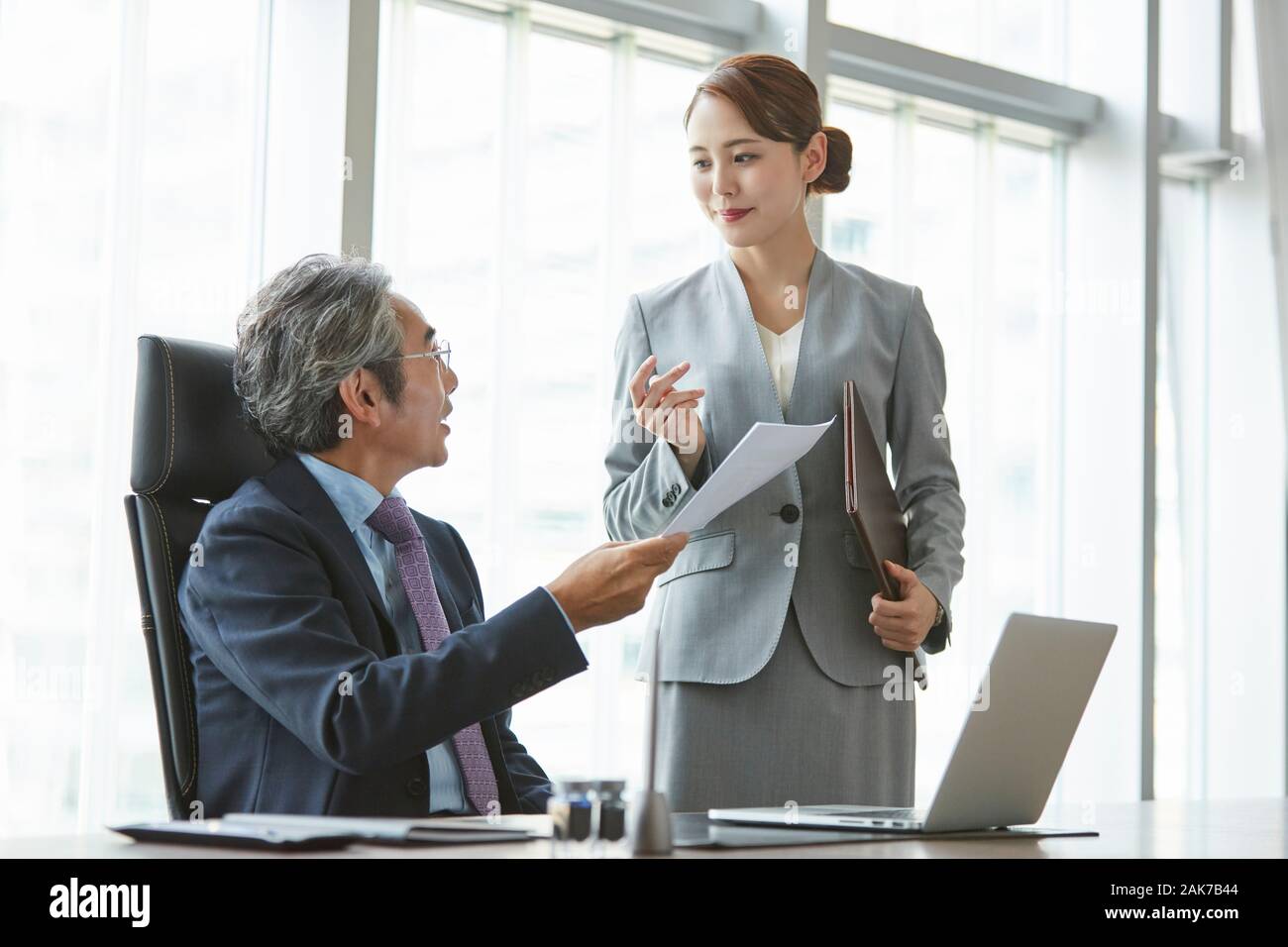 Senior Japanese businessman with his assistant Stock Photo - Alamy