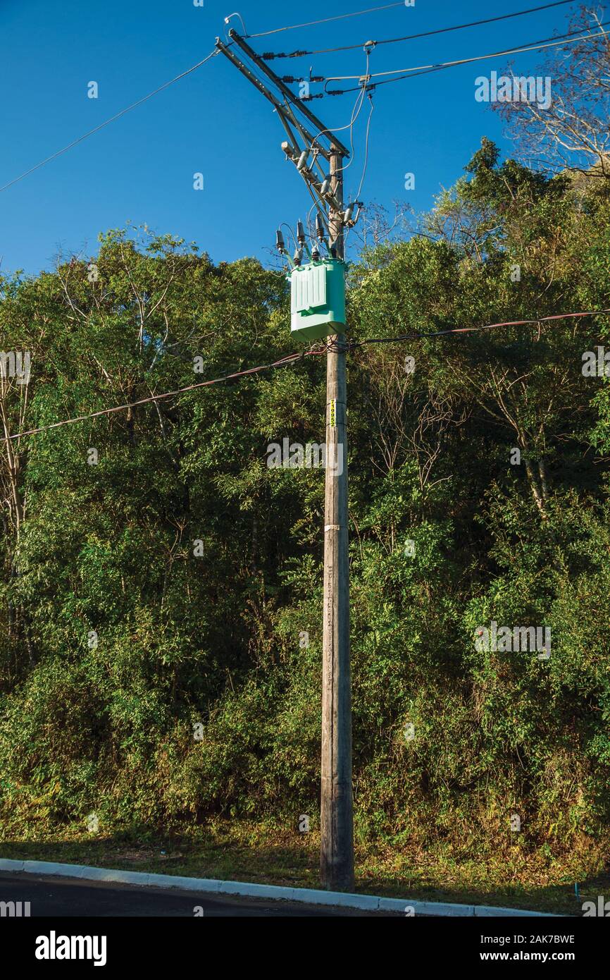 High-voltage power pole with transformer and electrical wiring on ...