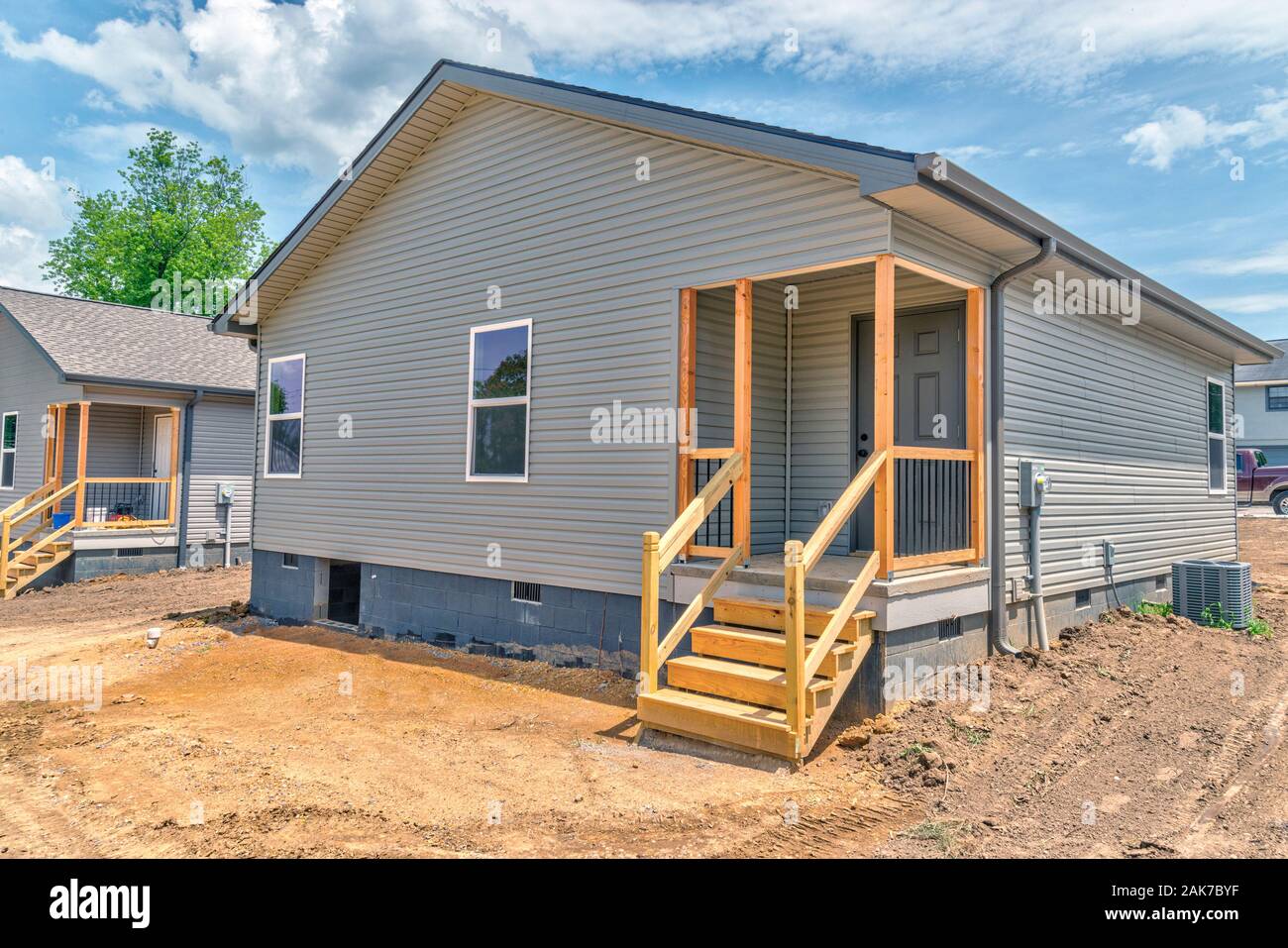 Horizontal shot of two small new houses under construction Stock Photo ...