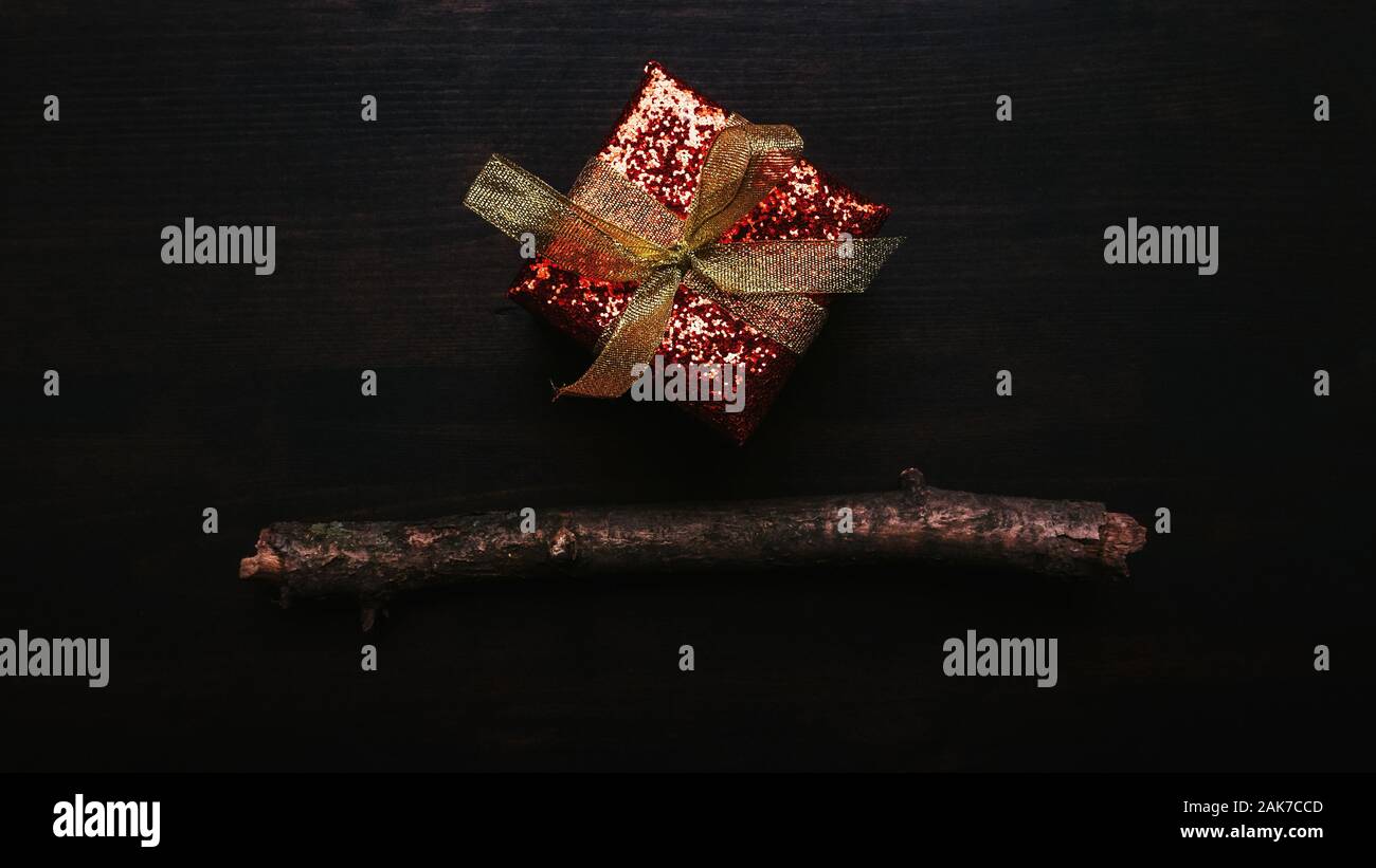 Gift box flat lay top view with copy space on dark wooden background ...