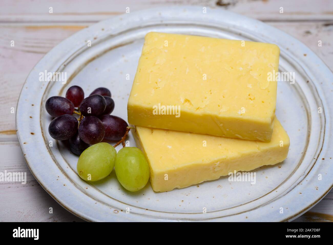 Cheese collection, blocks of matured english cheddar cheese close up ...