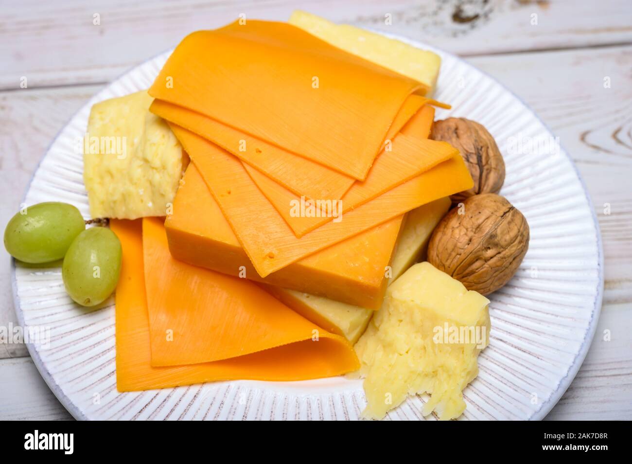 Cheese collection, blocks and slices of yellow and matures english ...