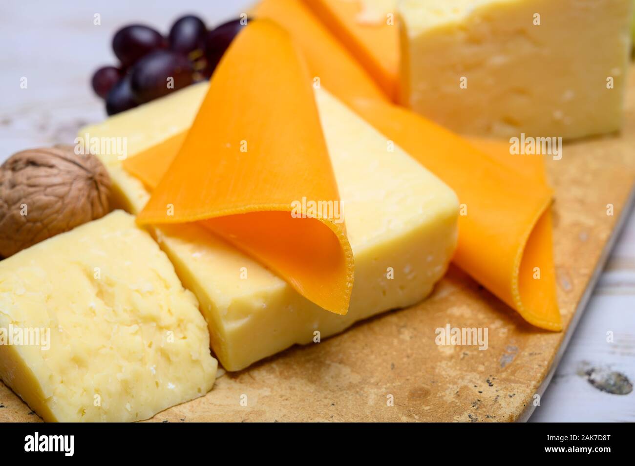 Cheese collection, blocks and slices of yellow and matures english ...