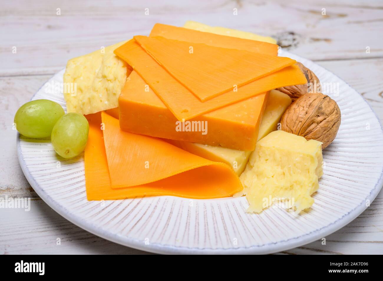 Cheese collection, blocks and slices of yellow and matures english ...