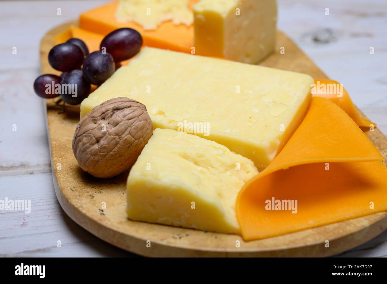 Cheese collection, blocks and slices of yellow and matures english ...