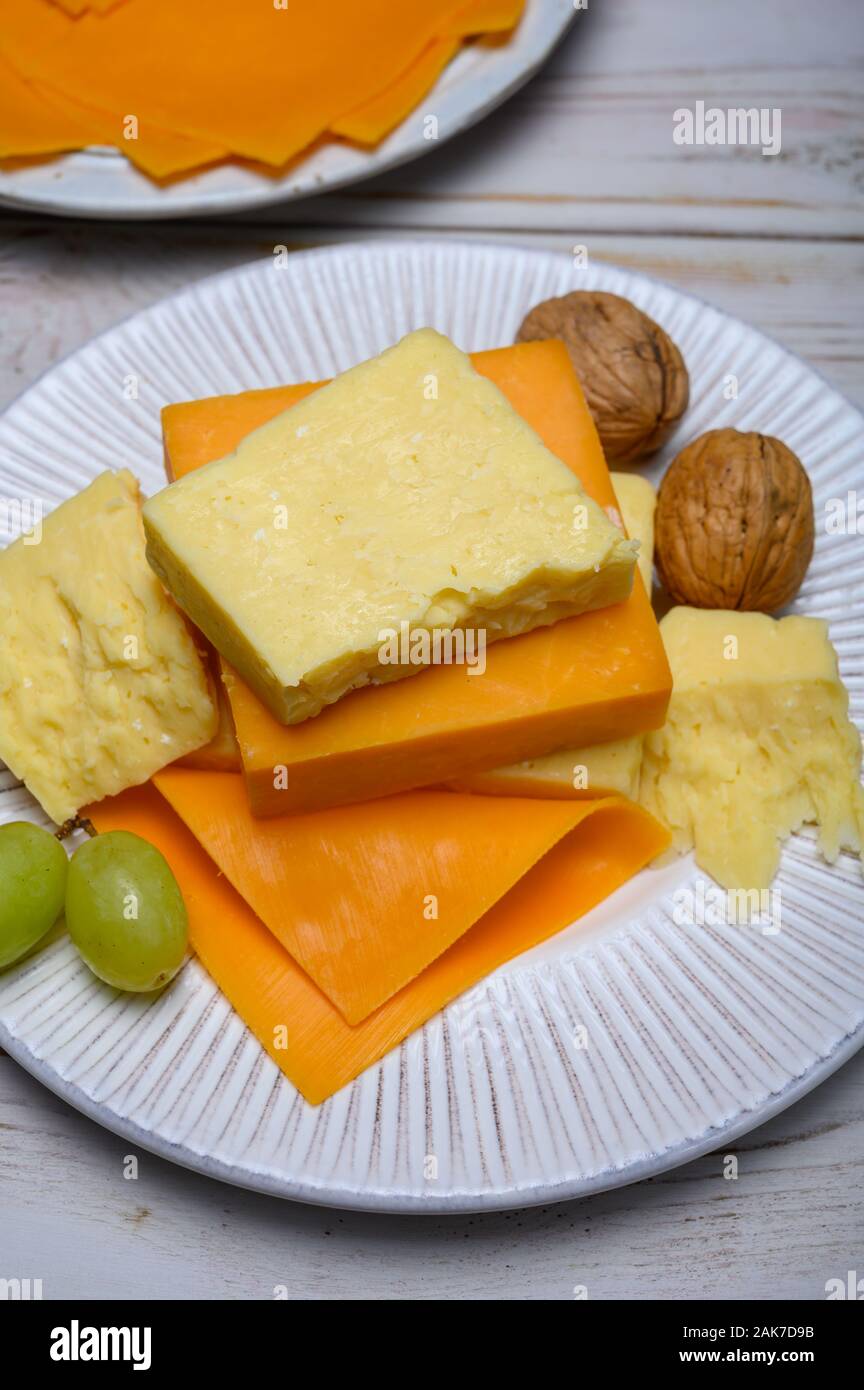 Cheese collection, blocks and slices of yellow and matures english ...