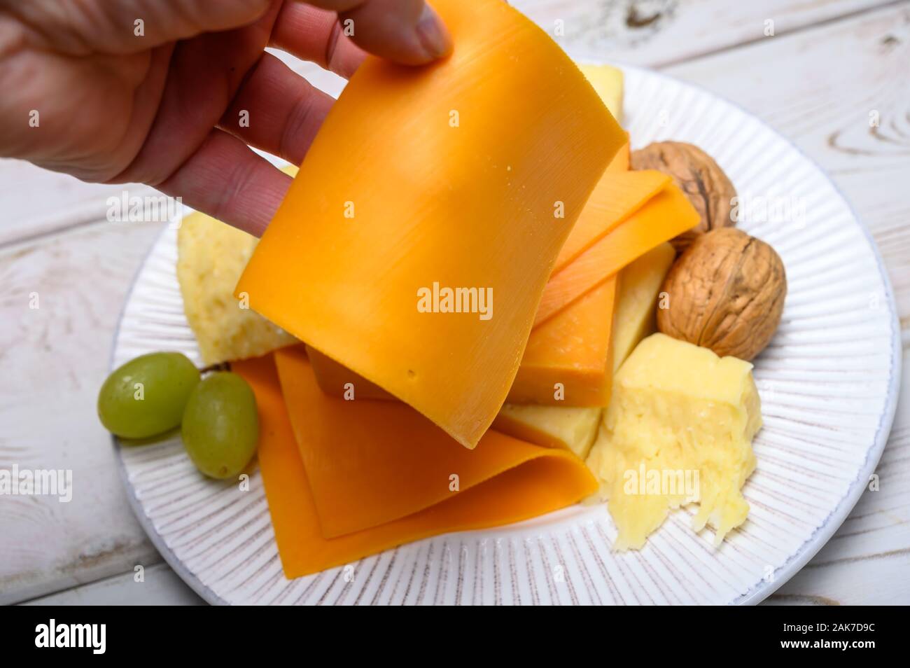 Cheese collection, blocks and slices of yellow and matures english ...