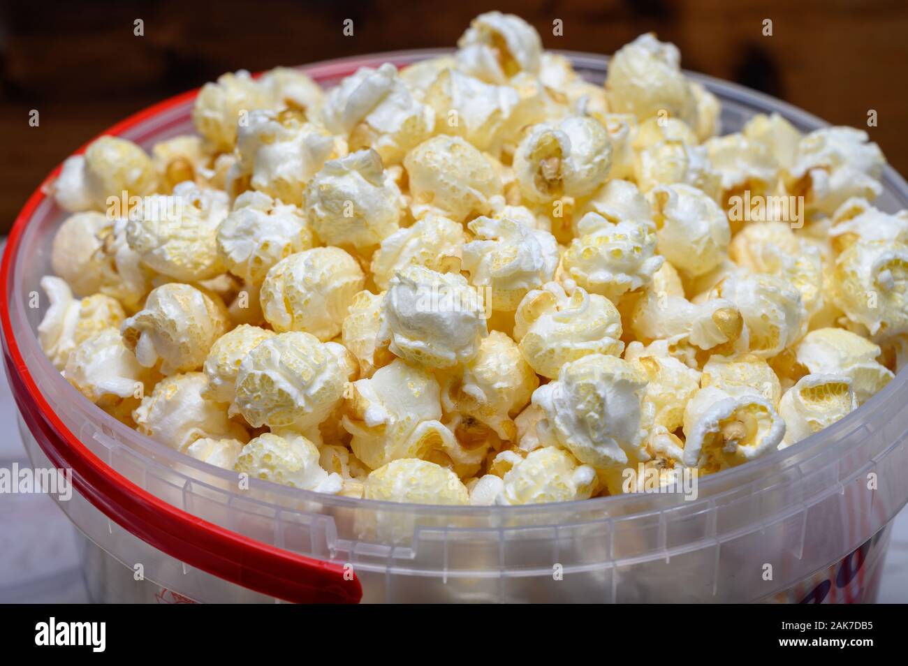 Plastic bucket with tasty sweet popcorn ready to eat Stock Photo - Alamy