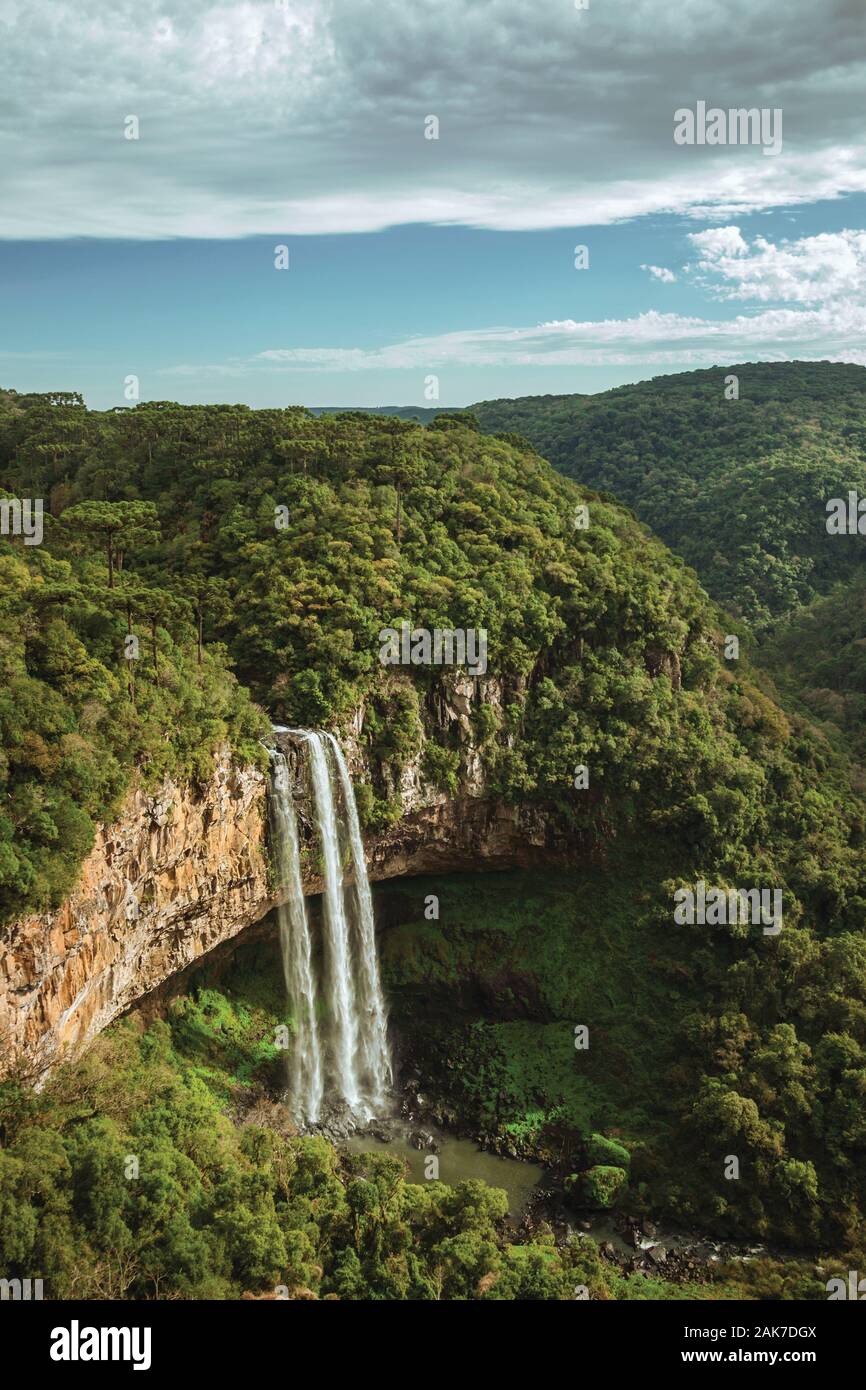 Caracol waterfall falling from rocky cliff in a forest from a park near ...