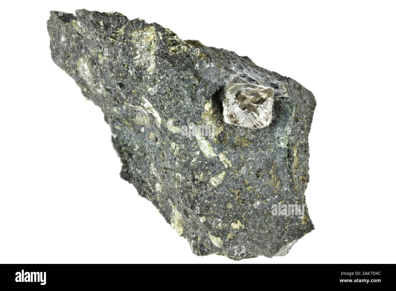 natural diamond nestled in kimberlite isolated on white background ...