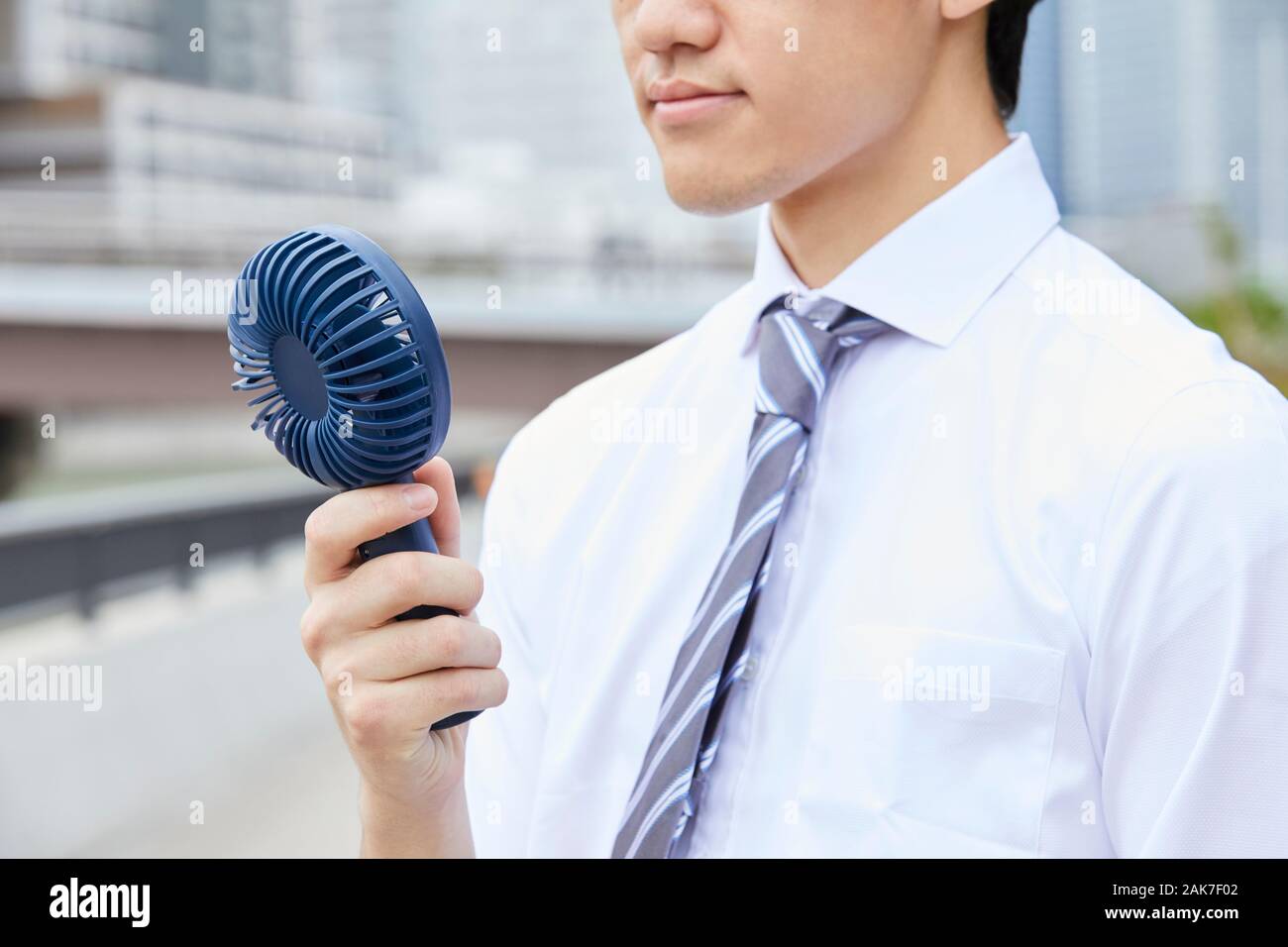 Man portable fan and hi-res stock photography and images - Alamy