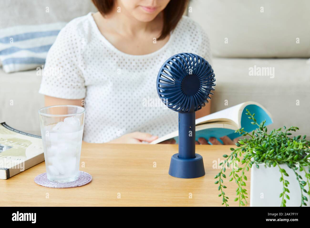 Japanese woman with portable fan Stock Photo - Alamy