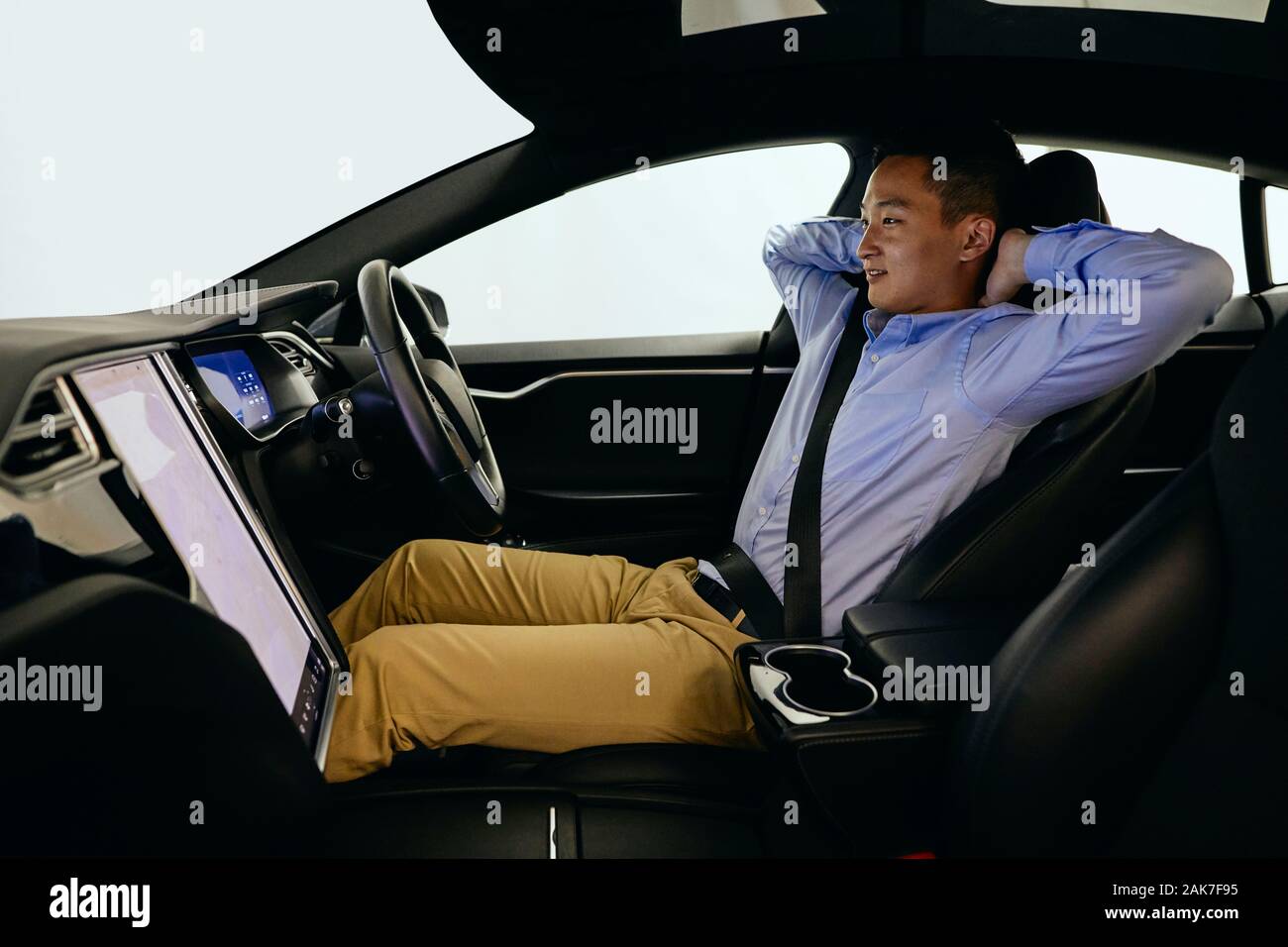 Japanese man in self driving car Stock Photo - Alamy