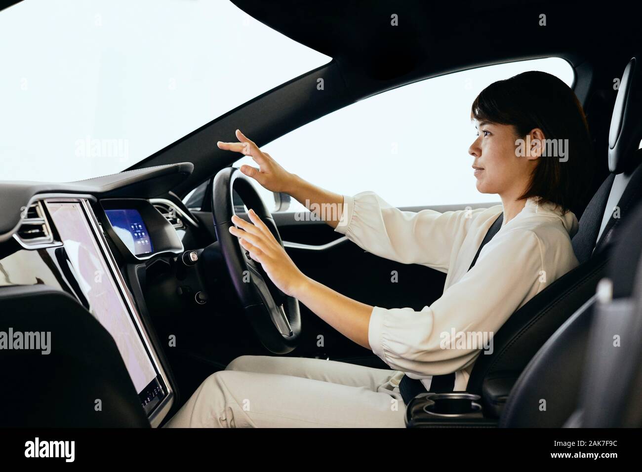 Japanese woman in self driving car Stock Photo - Alamy