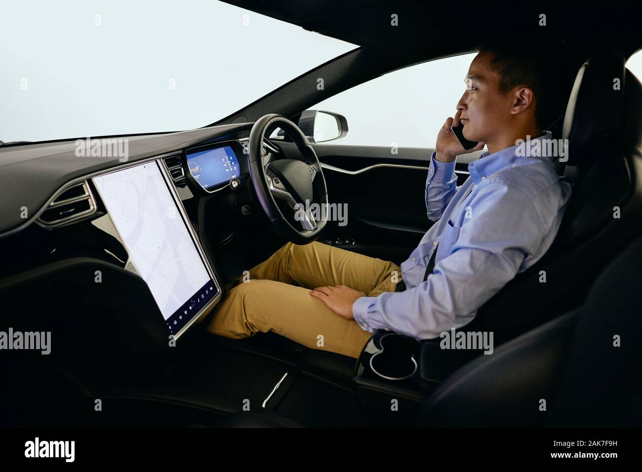 Japanese man in self driving car Stock Photo - Alamy