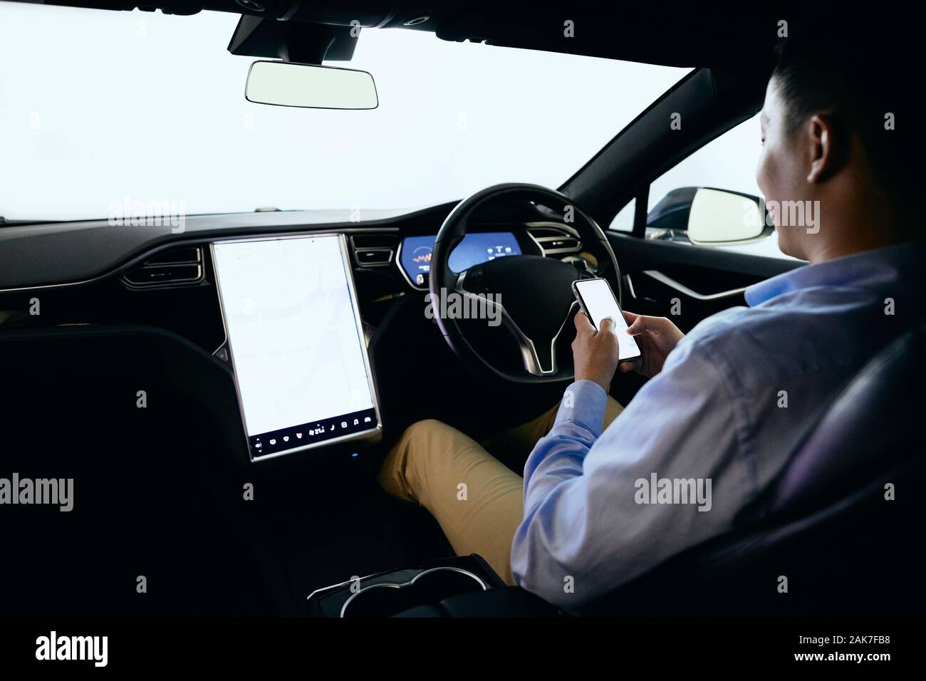 Japanese man in self driving car Stock Photo - Alamy