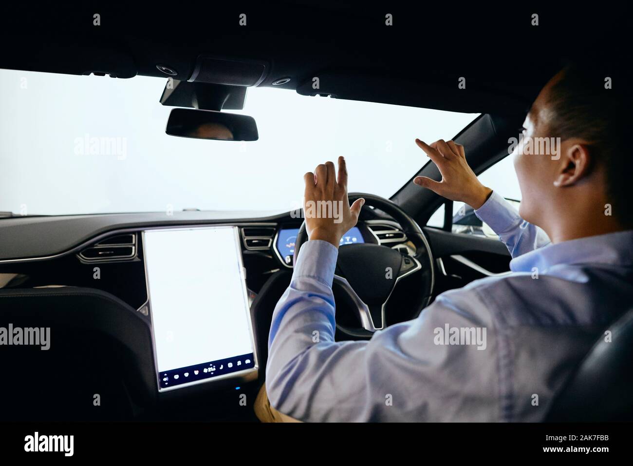 Japanese man in self driving car Stock Photo - Alamy