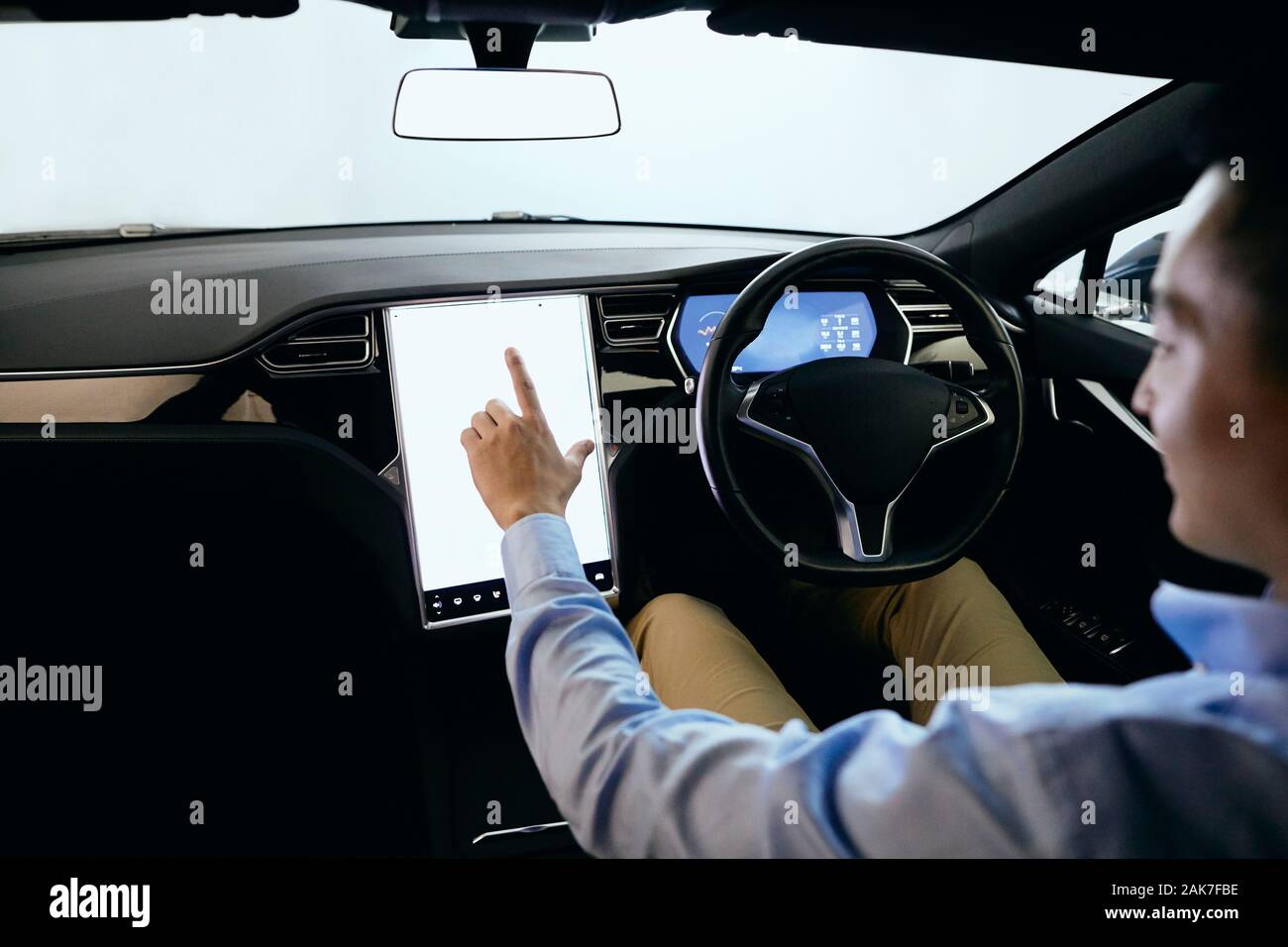Japanese man in self driving car Stock Photo - Alamy