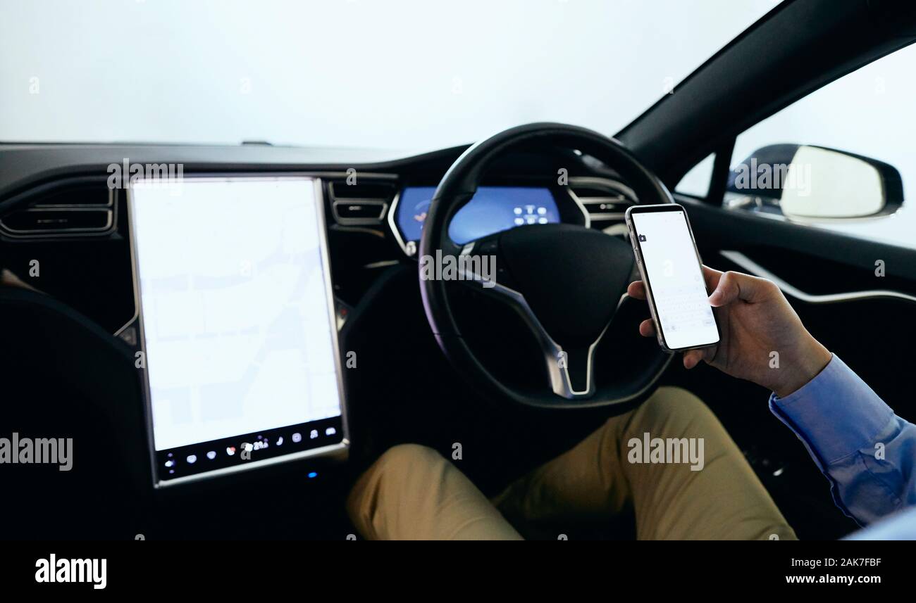 Japanese man in self driving car Stock Photo - Alamy