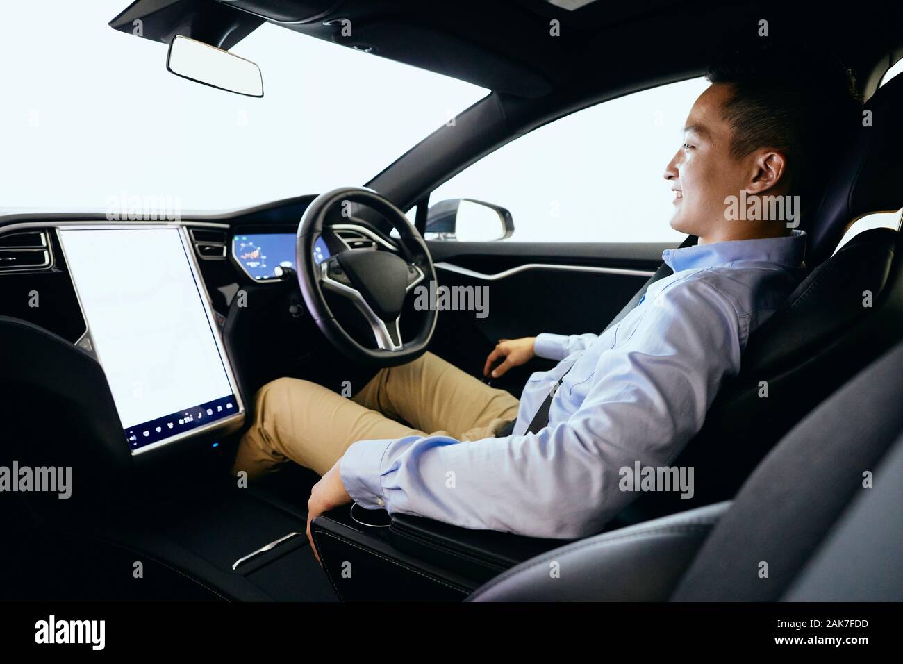 Japanese man in self driving car Stock Photo - Alamy