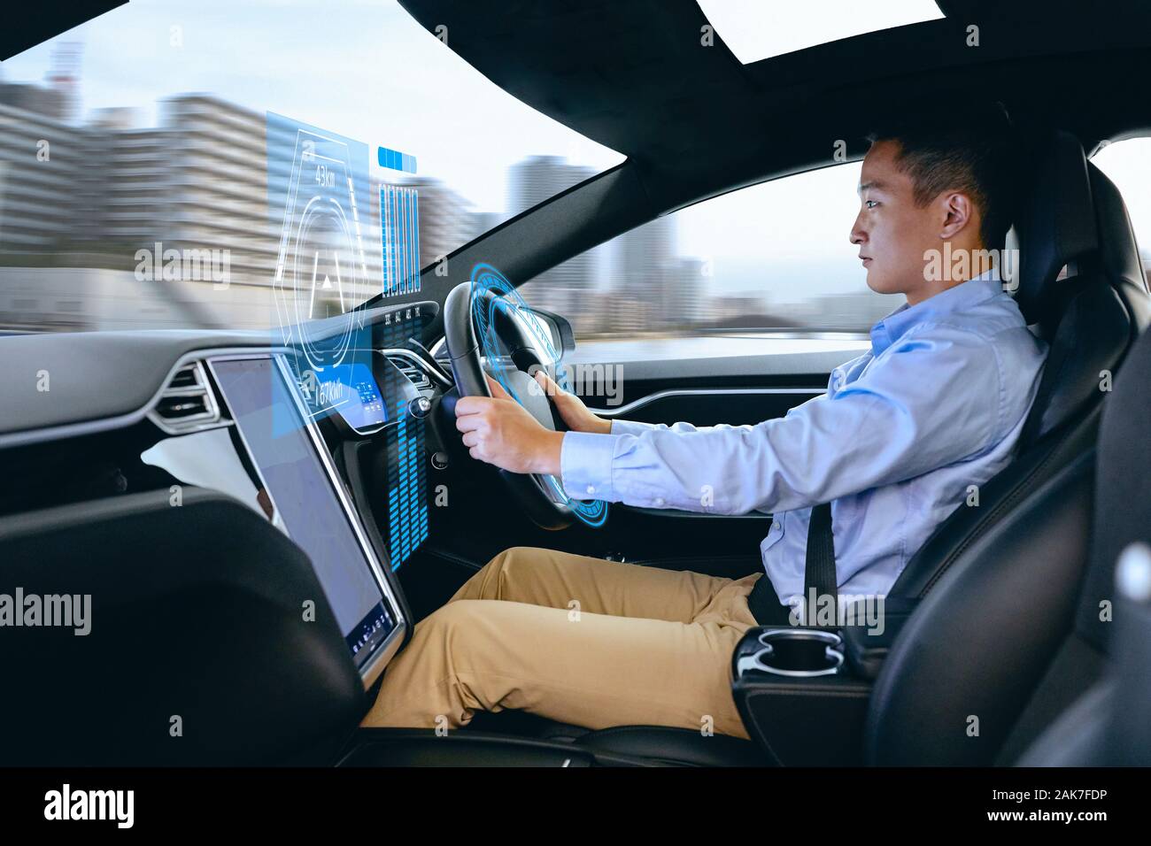 Japanese man in self driving car Stock Photo - Alamy