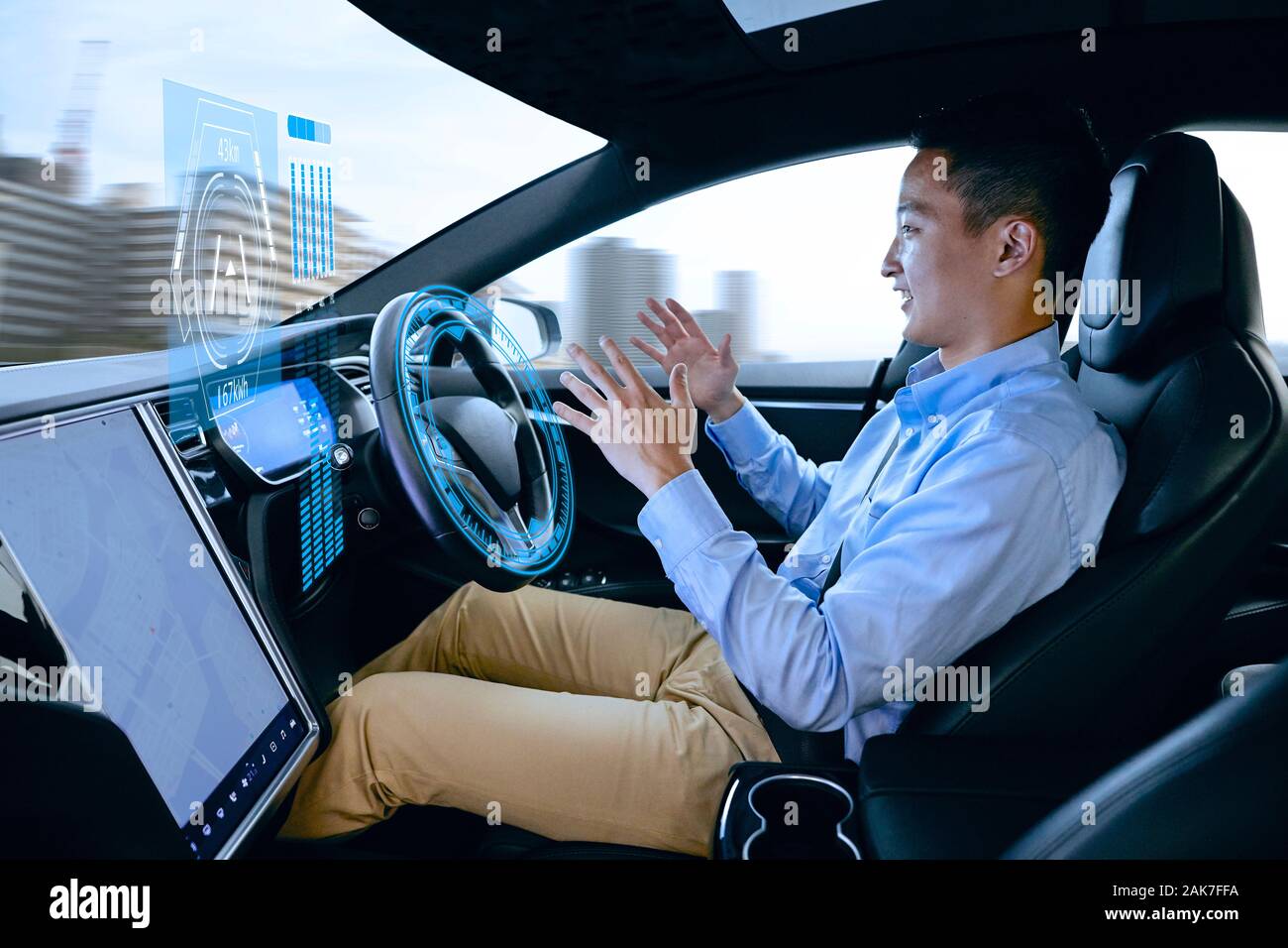 Japanese man in self driving car Stock Photo - Alamy