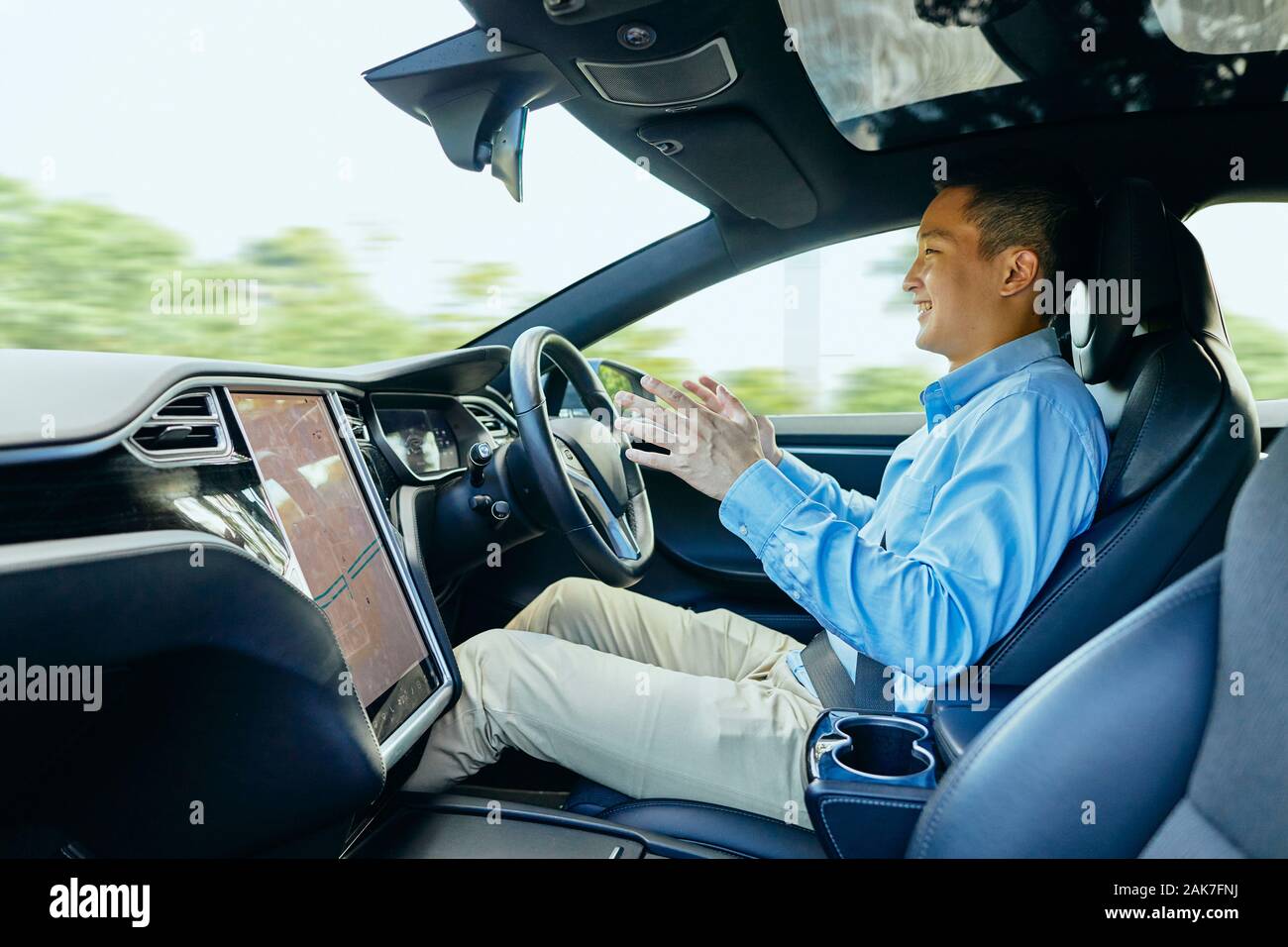 Japanese man in self driving car Stock Photo - Alamy