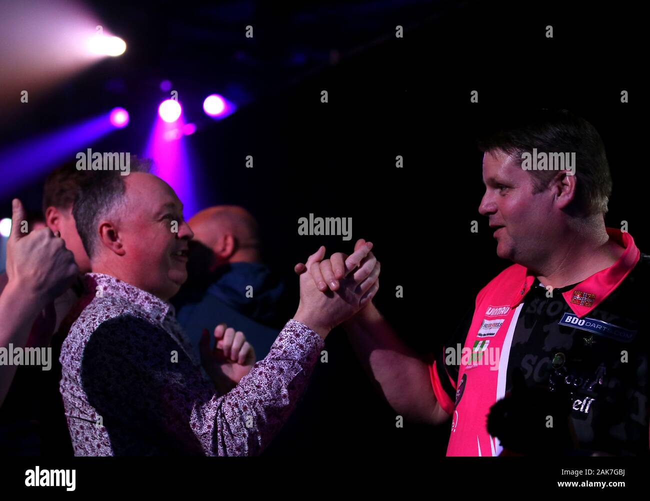 Scott Mitchell shakes hands with Rod Studd (centre) during day four of ...