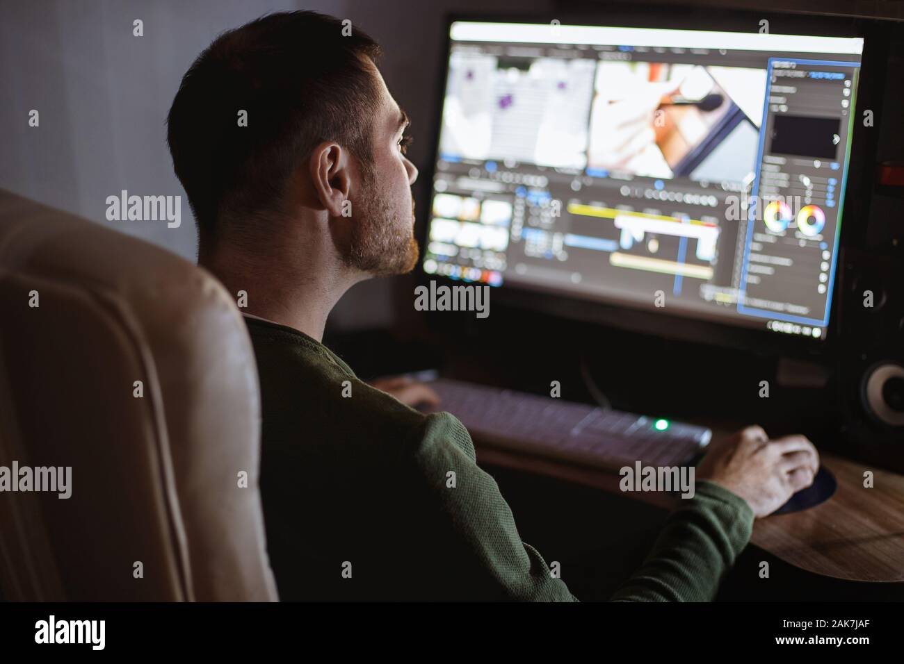 Video montager mounts video at desktop. Home workstation Stock Photo ...